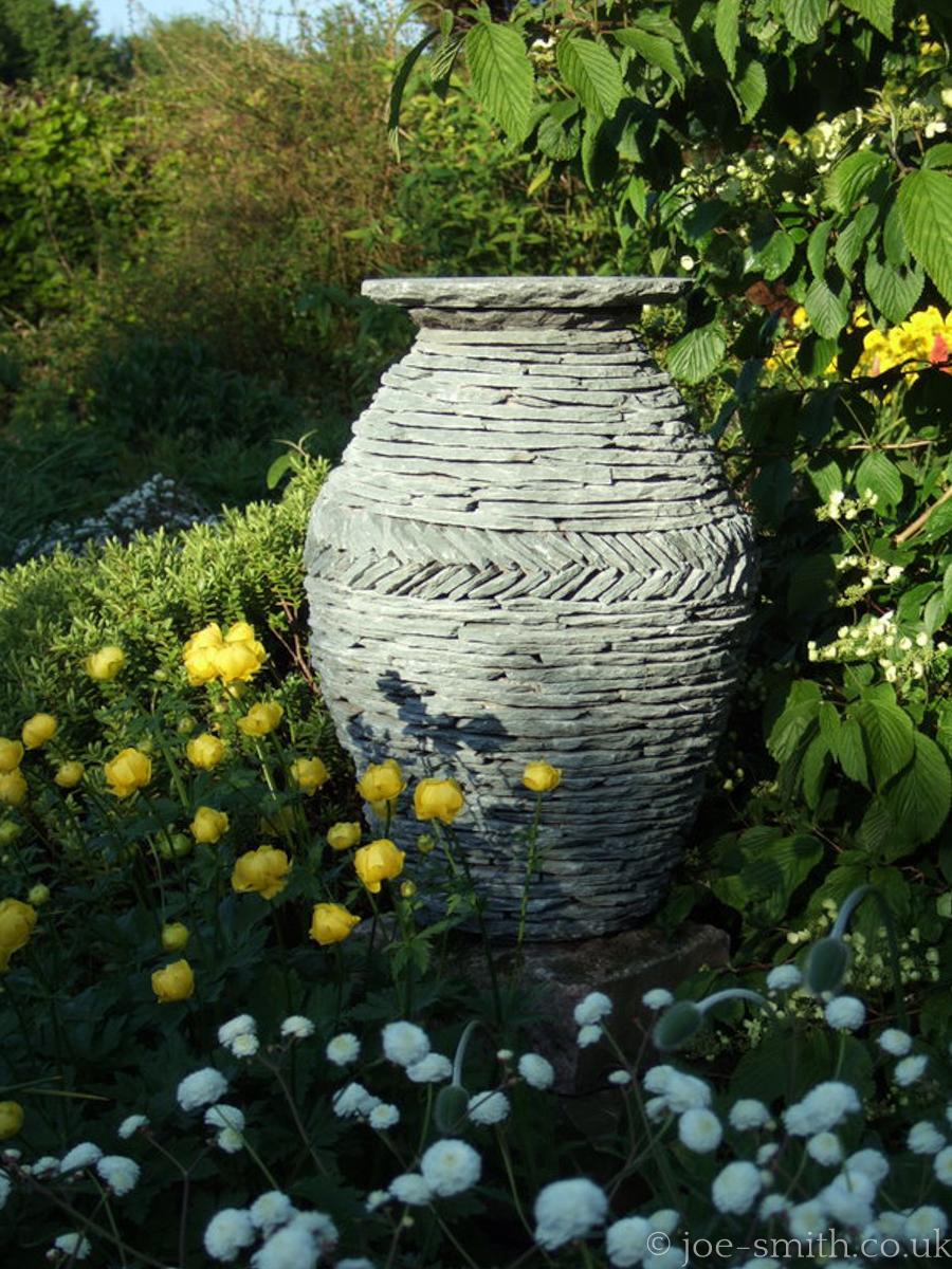 Vases and decorative sculpture for the garden, in slate and stone, by ...