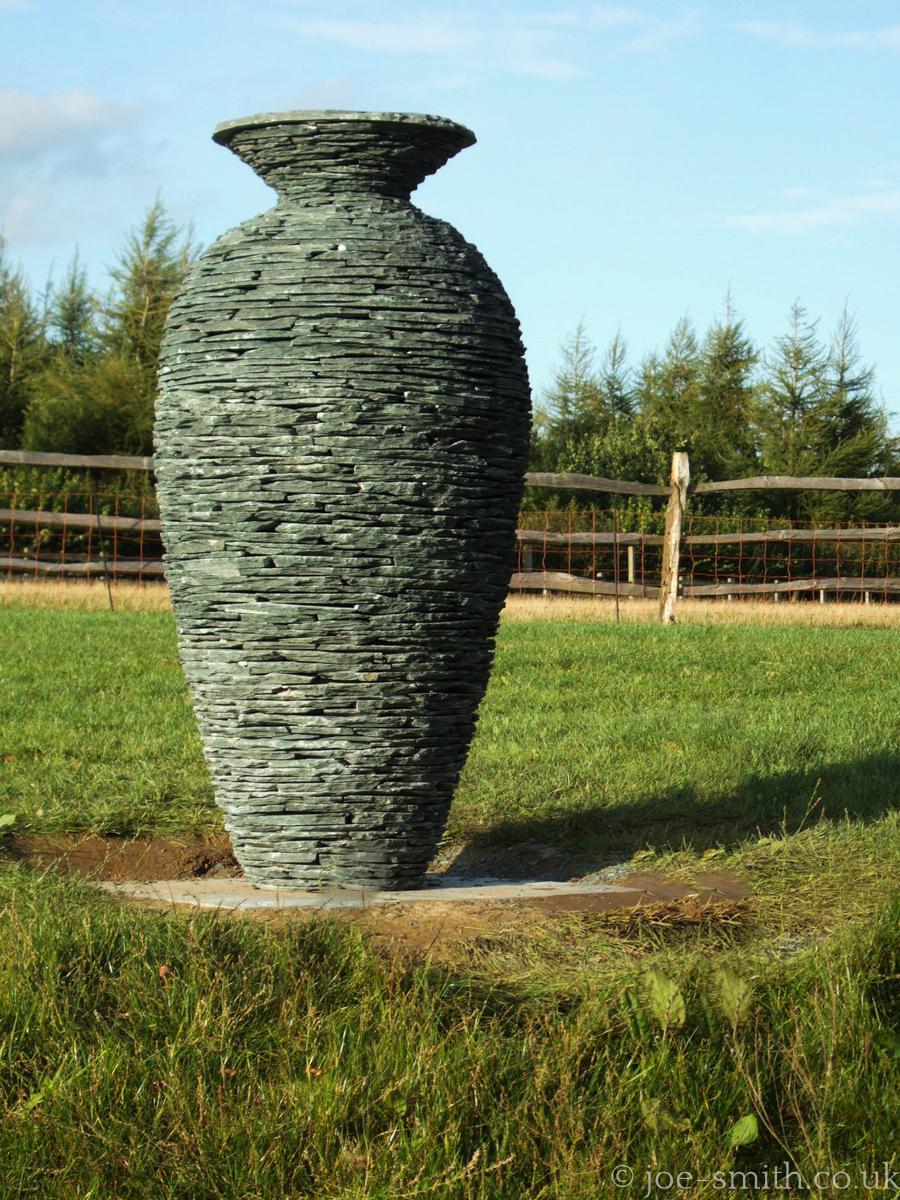 Vases and decorative sculpture for the garden, in slate and stone, by ...