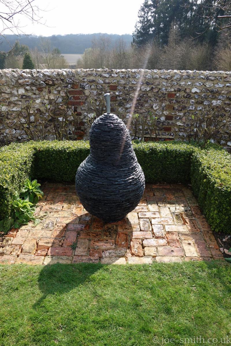 Vases and decorative sculpture for the garden, in slate and stone, by ...