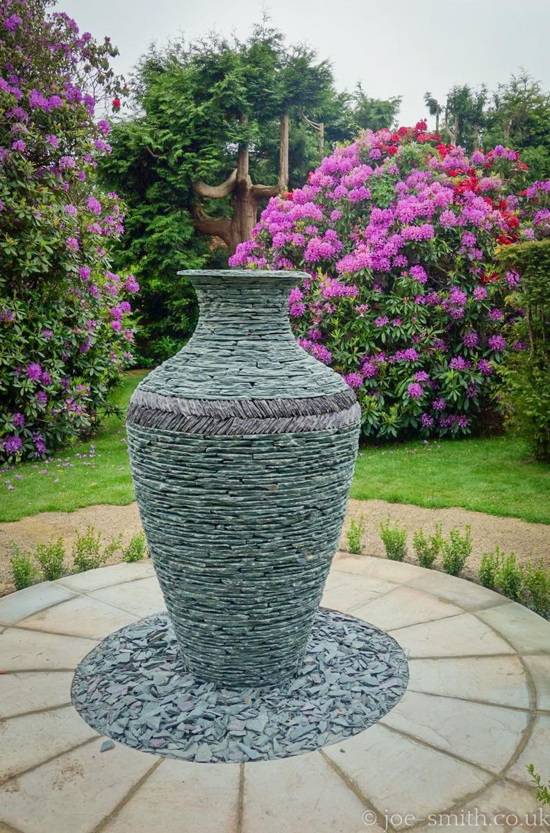 Vases and decorative sculpture for the garden, in slate and stone, by ...
