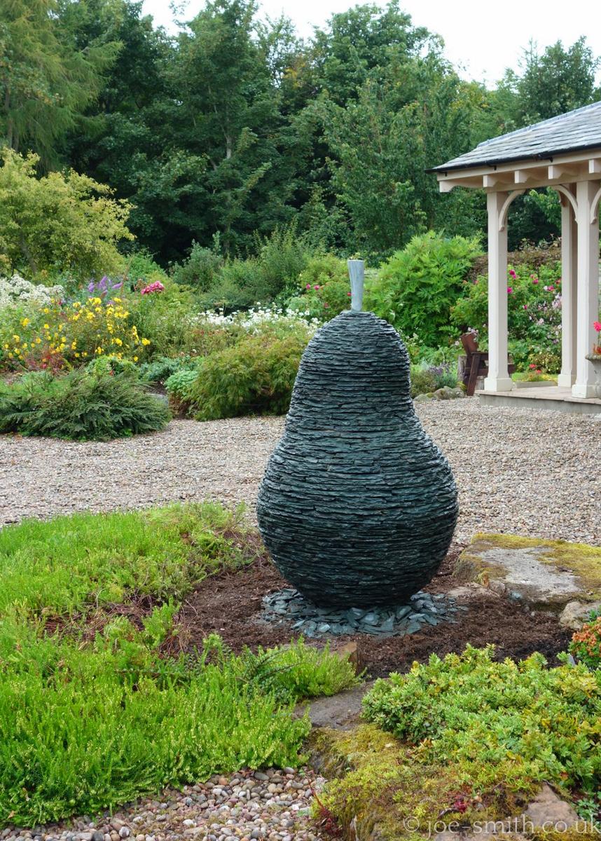 Vases and decorative sculpture for the garden, in slate and stone, by ...